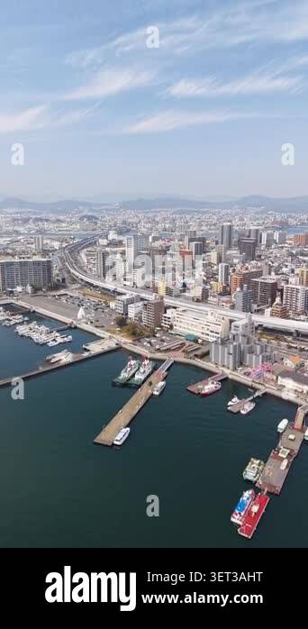 An aerial view of the city, harbour and industrial port of Hiroshima by ...