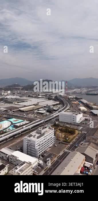 An aerial view of the city, harbour and industrial port of Hiroshima by ...