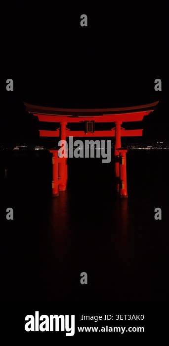 The iconic red floating torii gate of Itsukushima Shrine illuminated at ...