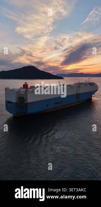An aerial view of a large cargo ship sailing the Seto Inland Sea at ...