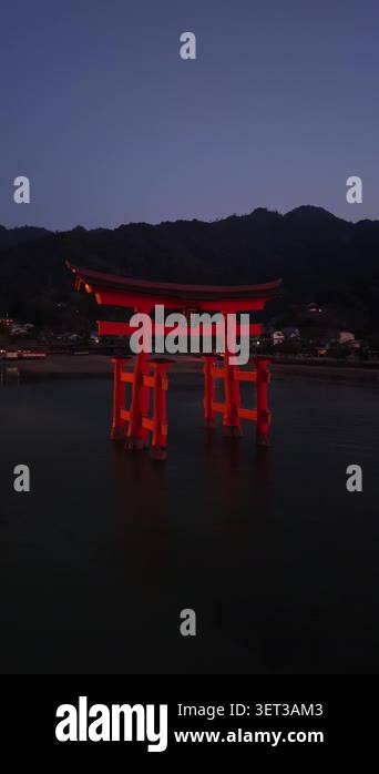 The iconic red floating torii gate of Itsukushima Shrine illuminated at ...