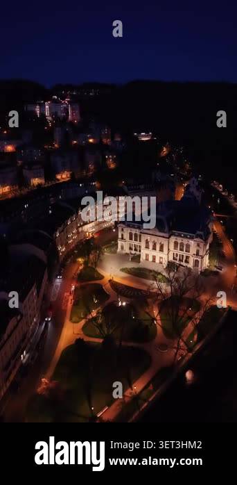 An aerial view of the spa town of Karlovy Vary illuminated at dusk and ...