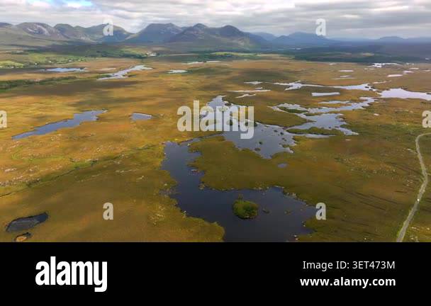 A Peat Lake in Donegal countryside, Ireland. Cinematic aerial Shot of a ...