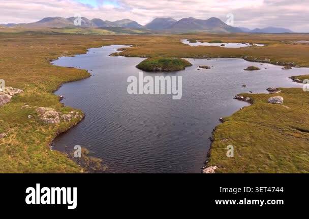A Peat Lake in Donegal countryside, Ireland. Cinematic aerial Shot of a ...