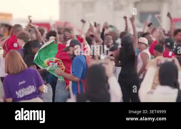 17 june 2026, lisbon, Portugal -People cheer and wave flags while ...