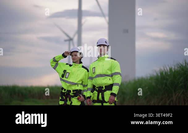 A professional Windmill engineer inspects and discusses operations at a ...