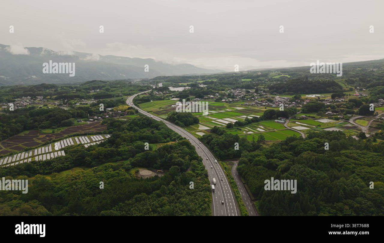 Aerial view of highway through rural landscape in Japan Stock Video ...