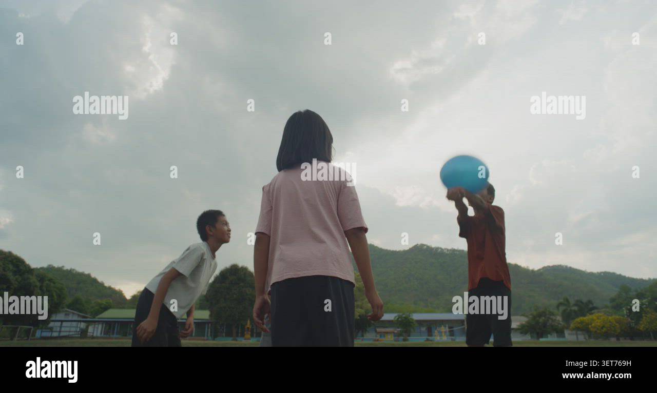 Slow motion: Children Playing With Blue Ball at Sunset Stock Video ...
