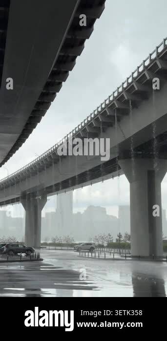 Rain pours from the gutters of the road bridge Stock Video Footage - Alamy
