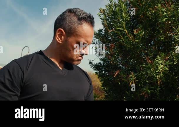 muscular man proudly checking his biceps Stock Video Footage - Alamy