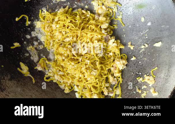 Frying yellow noodles in pan,indoor Changmai Thailand Stock Video ...