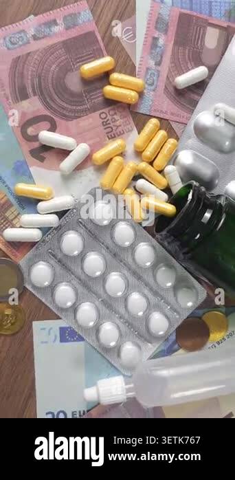 assorted medicines, blister packs, capsules and tablets scattered on ...