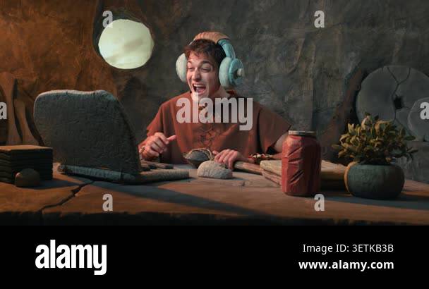 Funny Caveman on Video Call Wearing Headphones and Talking into ...