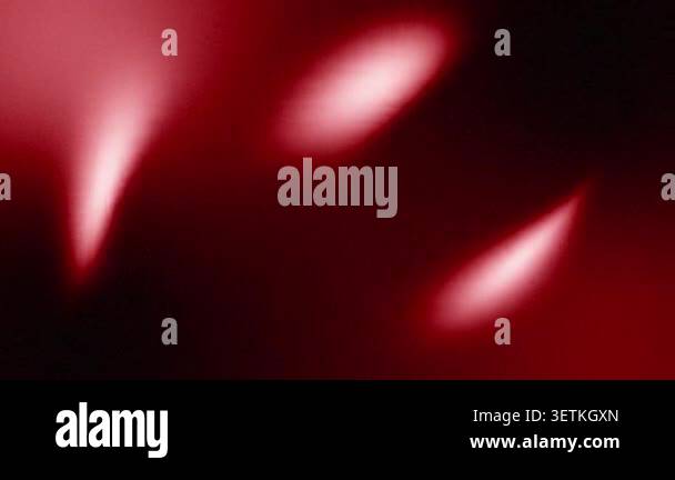 Abstract red light leaks and lens flares create a dynamic motion ...