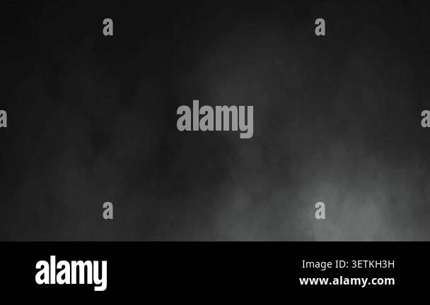 Ethereal smoke billows and dissolves on a mysterious black background ...