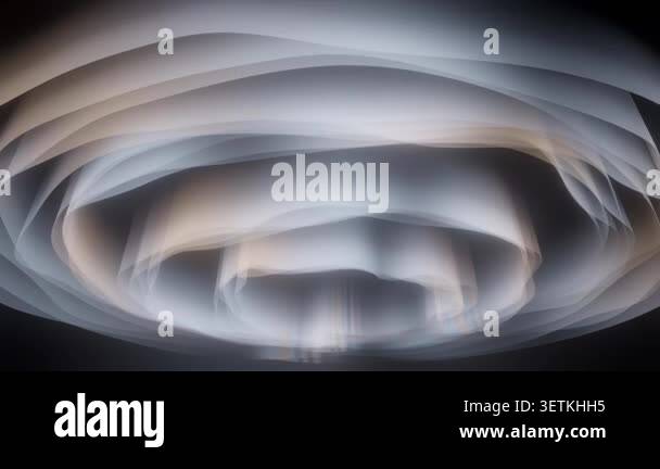 Abstract circular glowing light layers with motion blur and soft warm ...