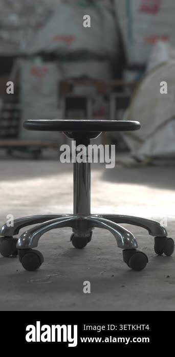 Lonely Metal Stool In Warehouse Illuminated By Shaft Of Light, Dusty ...
