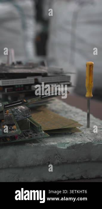 Stacked Circuit Boards On Workbench With Bulk Waste Bags In Background ...