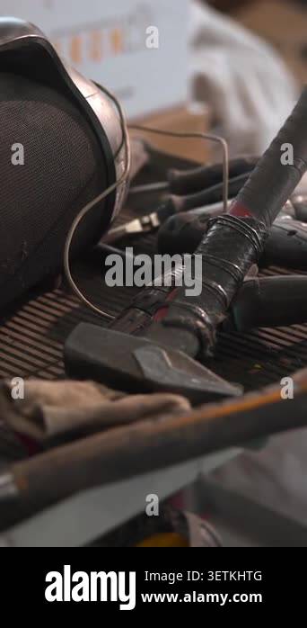 Rusty Exhaust And Flashlight On Bench, Cordless Drill And Wrench ...