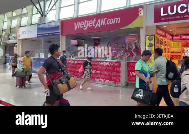 Authentic airport scene featuring travelers, terminal activity and a ...