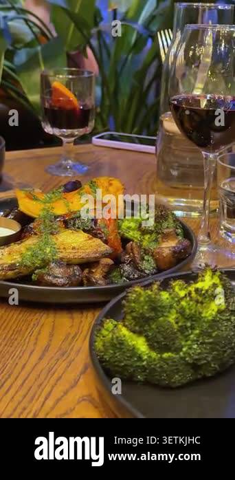 Juicy beef steak with grilled vegetables and cranberry sauce is served ...
