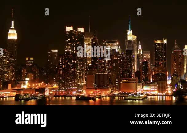 New York City skyline at night with illuminated skyscrapers and ...