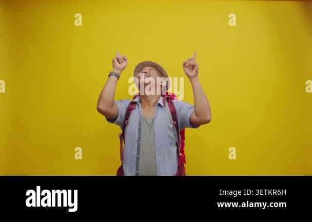 Backpacker in a Straw Hat and Red Backpack Gesturing Toward Blank Copy ...