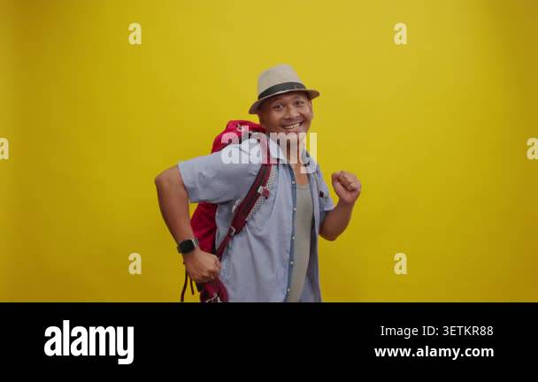 Cheerful Traveler Celebrating and Dancing with Happiness on a Yellow ...
