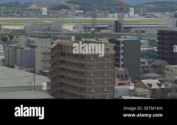 Cityscape view of a residential neighborhood with an airport runway and ...