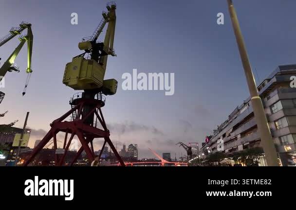 Silhouette of old industrial cargo cranes with unidentifiable ...