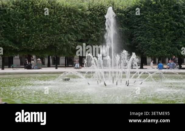 PARIS, FRANCE, JUNE 4, 2026 Large water fountain sprays in the Jardin ...