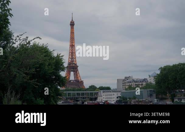 PARIS, FRANCE, JUNE 4, 2026 The illuminated Eiffel Tower stands behind ...