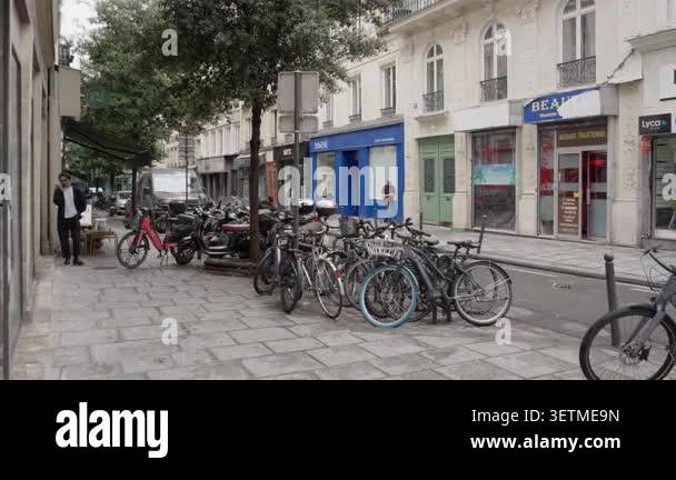 PARIS, FRANCE, JUNE 4, 2026 Numerous bicycles are parked at a city rack ...