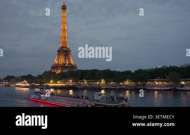 PARIS, FRANCE, JUNE 4, 2026 The illuminated Eiffel Tower stands under a ...