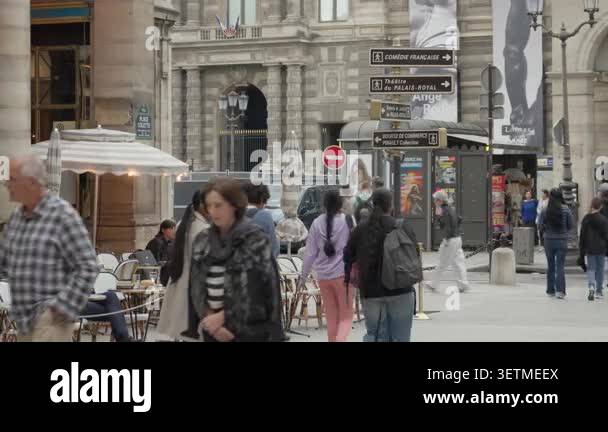 PARIS, FRANCE, JUNE 4, 2026 Crowds of pedestrians and tourists walk ...