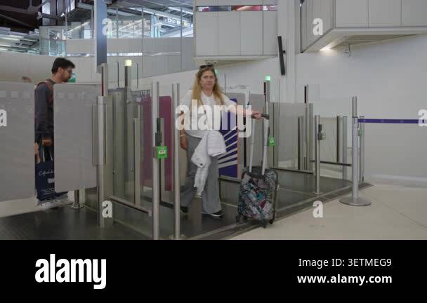 PARIS, FRANCE, JUNE 4, 2026 Passengers pass through automated ...