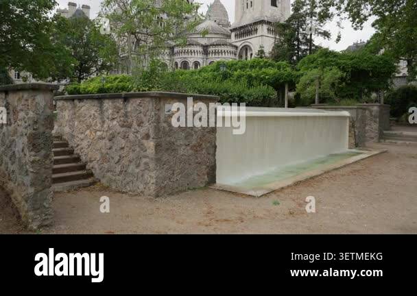 Public park cascade fountain with flowing water on Montmartre in Paris ...