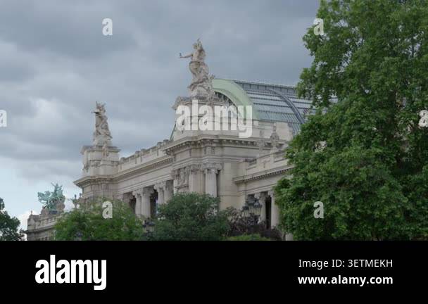 Grand Palais historic exhibition facade with sculptures and glass roof ...