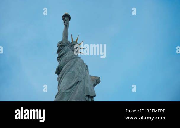 Statue of Liberty replica monument stands against the sky in Paris ...