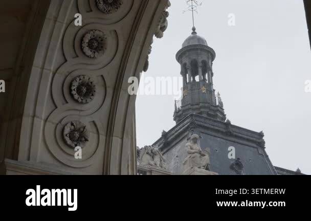 Louvre museum palace architecture stands under heavy rain in Paris ...
