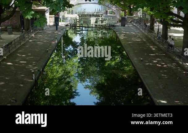 Saint-Martin canal water reflection showcases green city ecosystem in ...