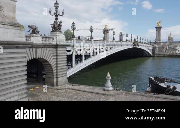 Pont Alexandre III bridge spans the Seine river in Paris France ...
