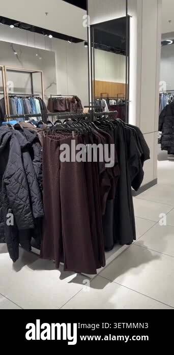Modern Fashion Boutique Interior With Seasonal Clothing Collection ...