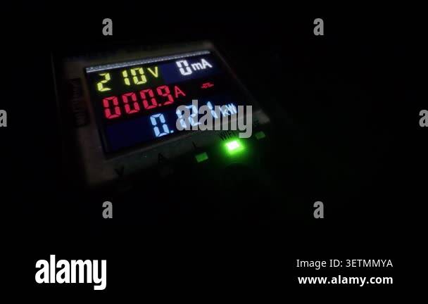 Electrical measuring device with colorful display showing voltage and ...