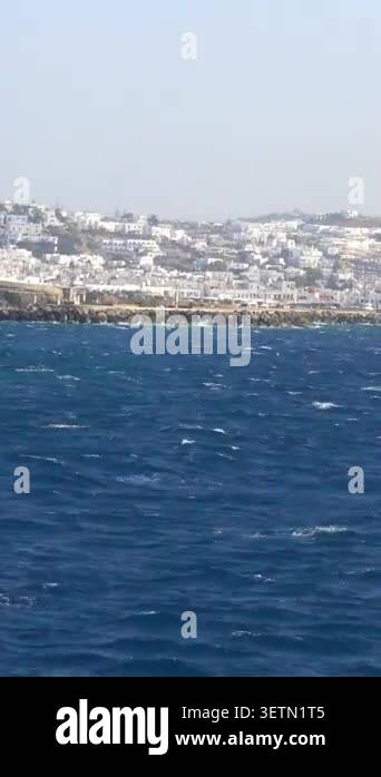 Deep blue sea water rippling in the wind with the Mykonos island ...