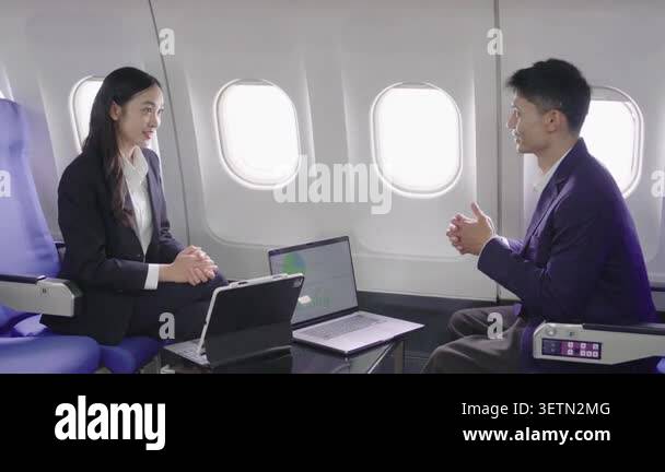 Business professionals are interacting with corporate passengers who ...