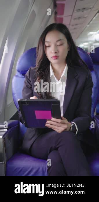 Diverse corporate passengers sitting in a modern business class ...