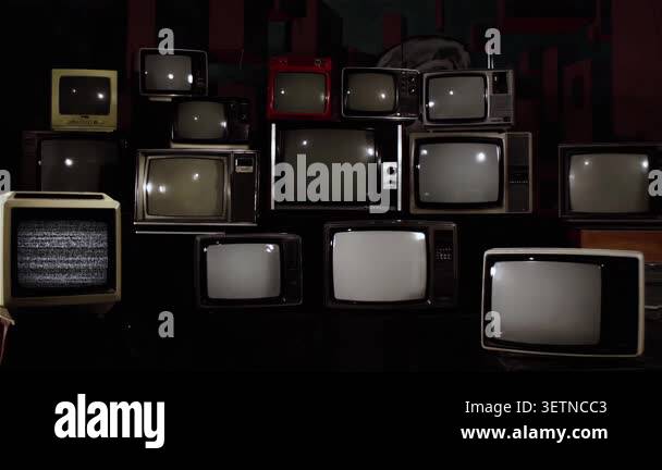 Vintage TV Wall with One Monitor Powering On to Chroma Key, Zoom In ...