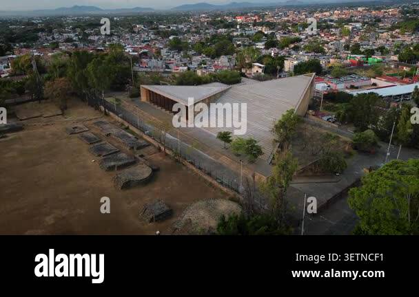 Aerial drone slowly approaches the Teopanzolco Cultural Center in ...
