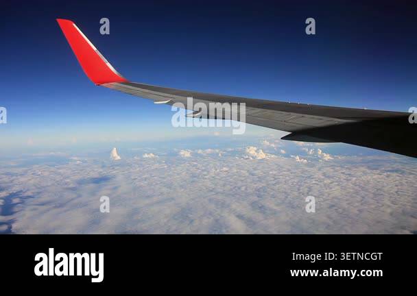 Commercial Aircraft Wing Flying Over Dense Clouds Horizon - 4K Stock ...